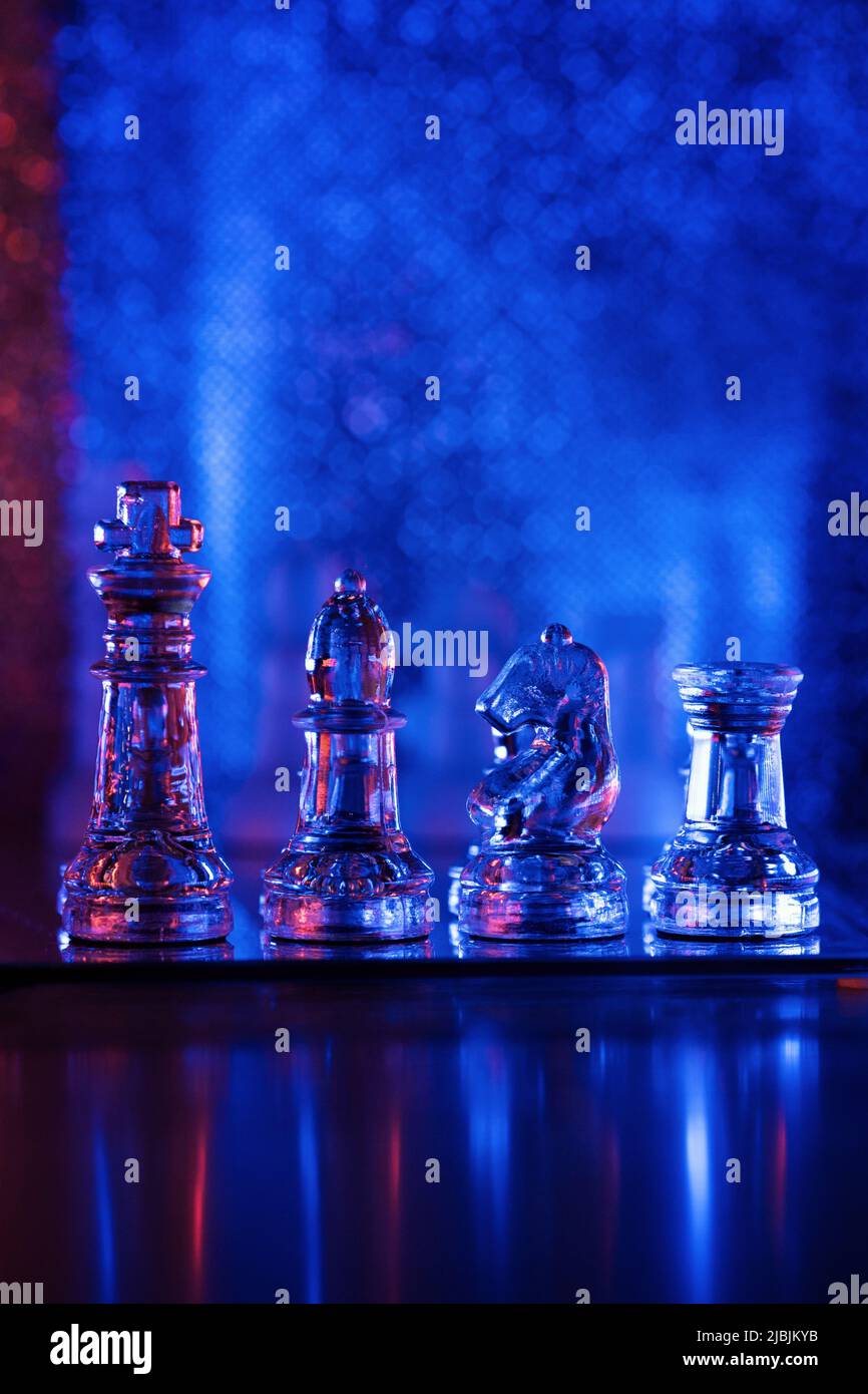 Transparent glass chess pieces. King, Bishop, Knight and Rook on ...