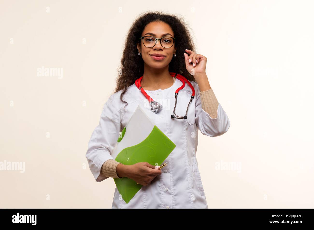 African American Woman Intern General Practitioner hold medical history ...