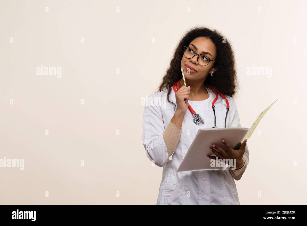 Dark Skinned Female Doctor in Uniform with Eyeglasses and Stethoscope ...