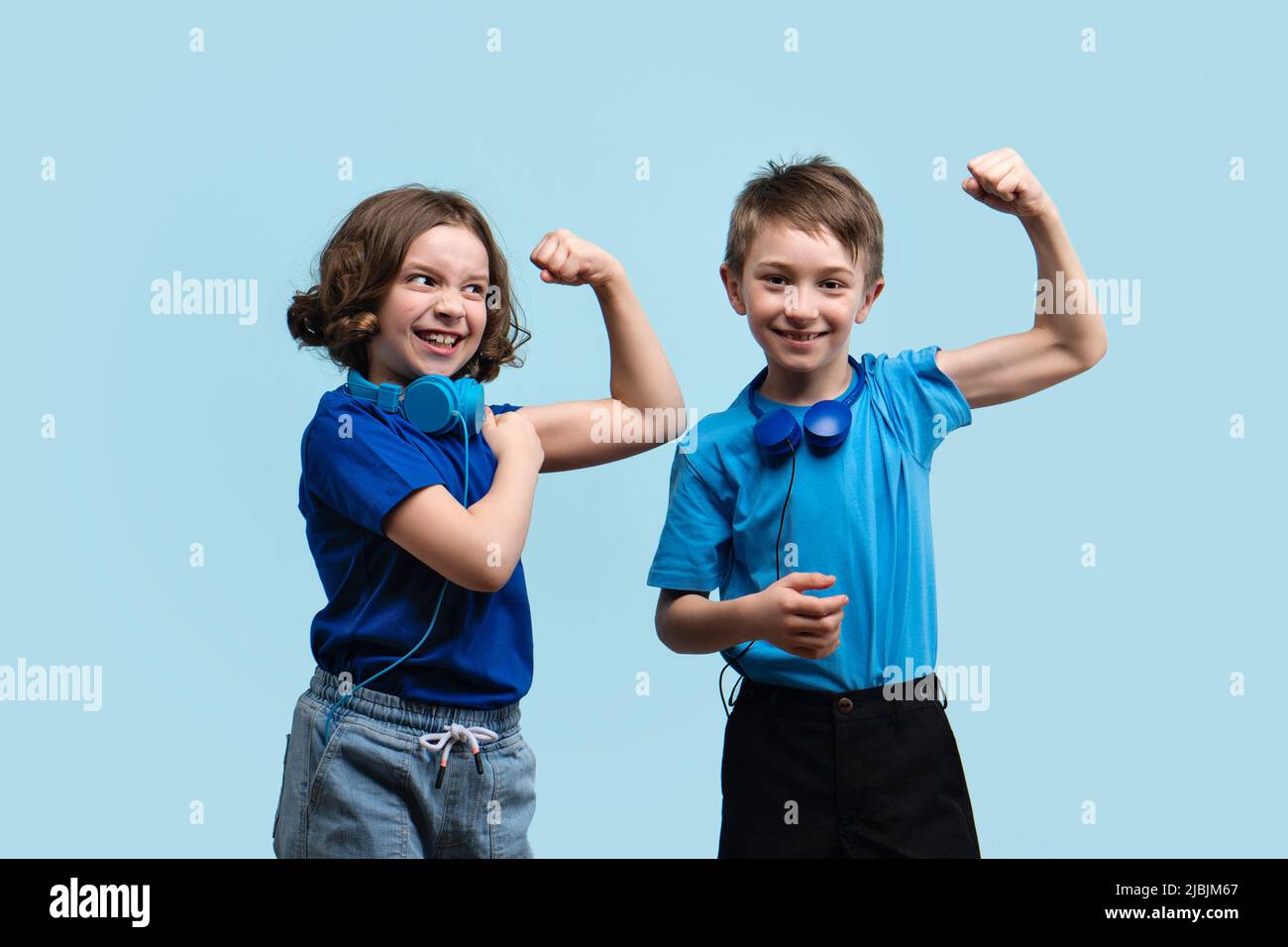 Showing off biceps hi-res stock photography and images - Alamy