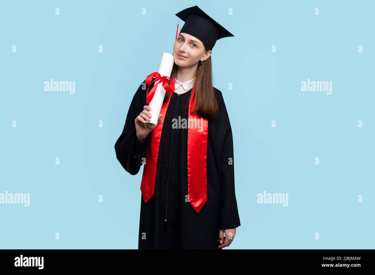 Proud Girl Graduate Wearing Ceremony Robe and Graduation Cap Holding ...