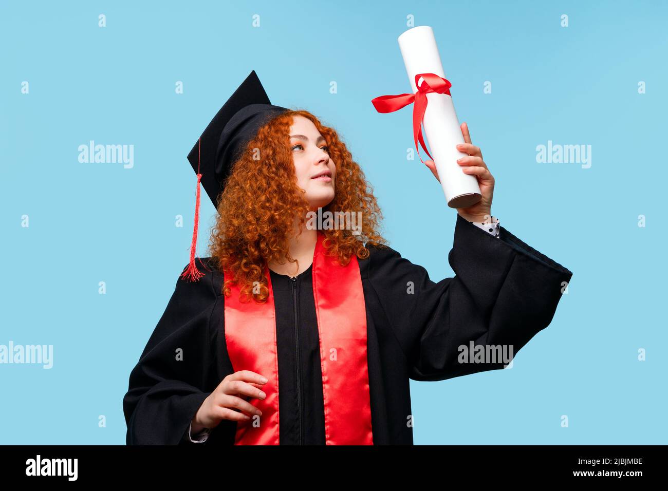 Graduate Female Student Wearing Ceremony Robe and Graduation Cap ...