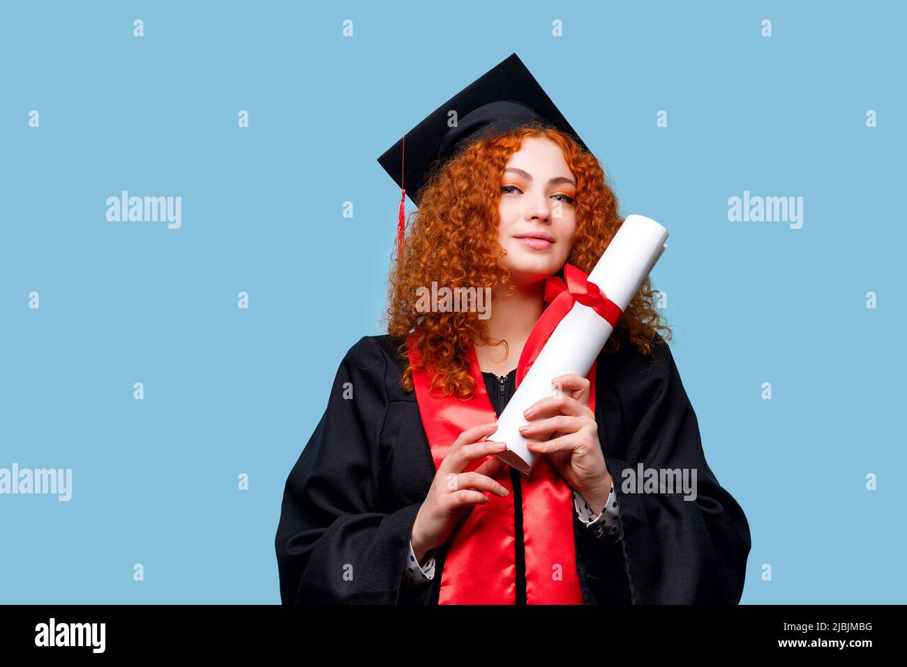 Cute Curly Red Haired Female Graduate in Ceremony Robe and Graduation ...