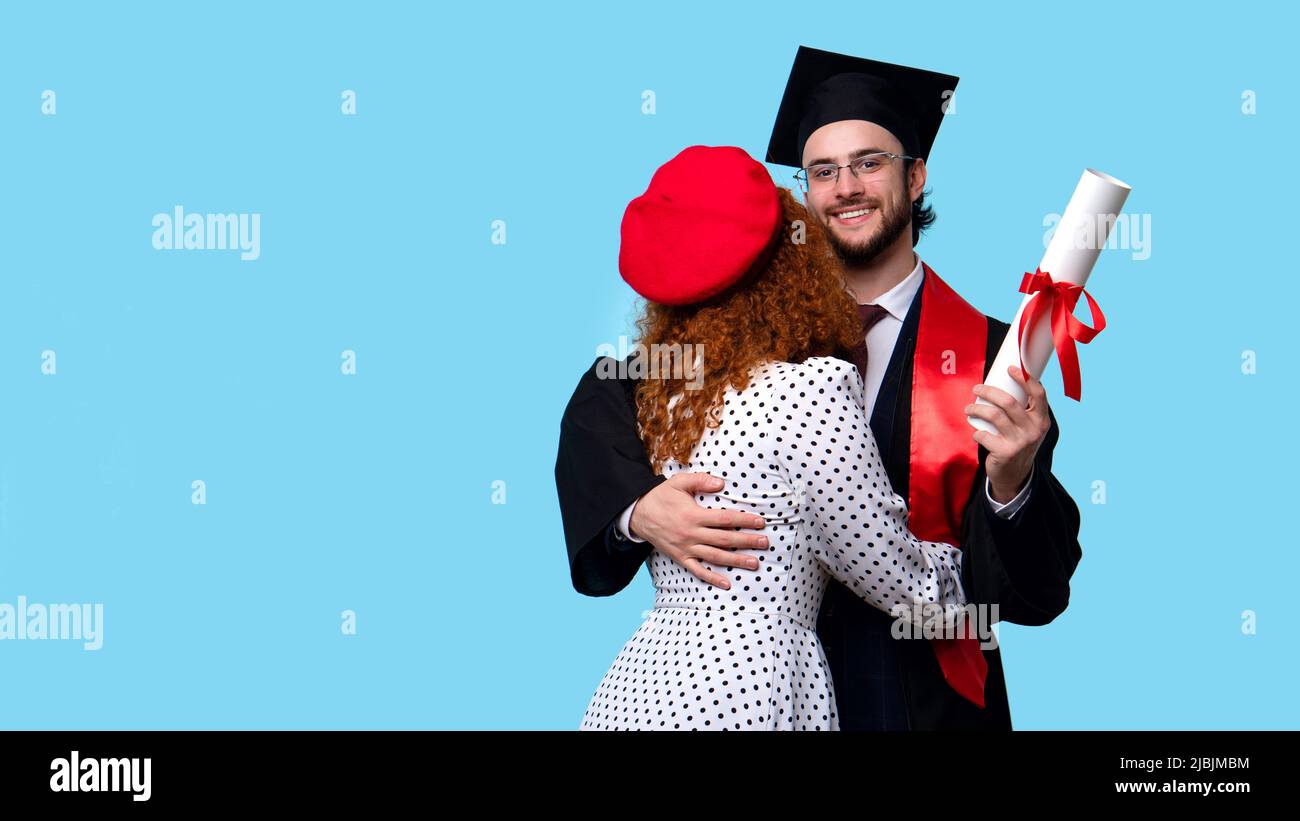 Celebrating graduate in academic dress hi-res stock photography and ...