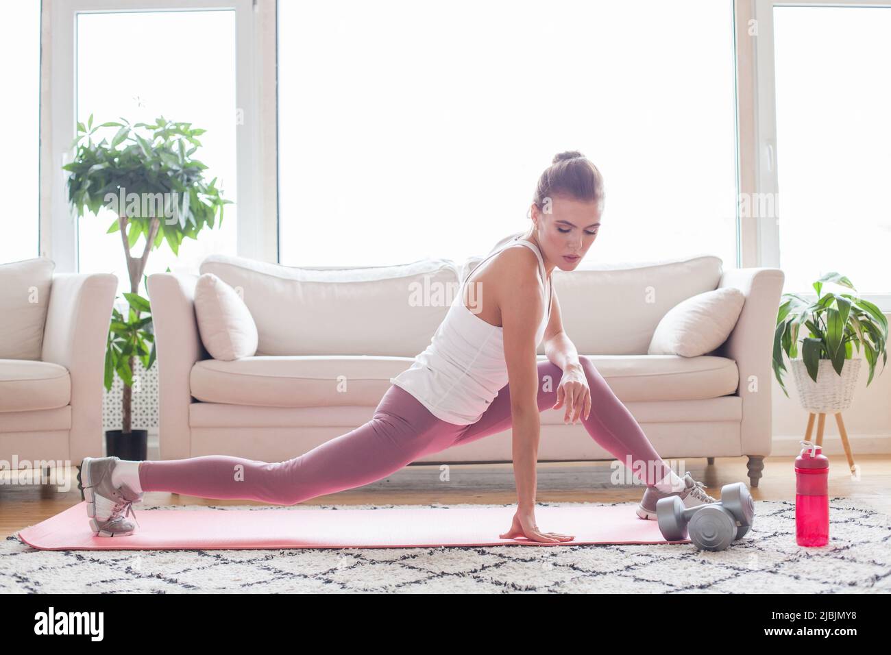 Woman lunges home hi-res stock photography and images - Alamy