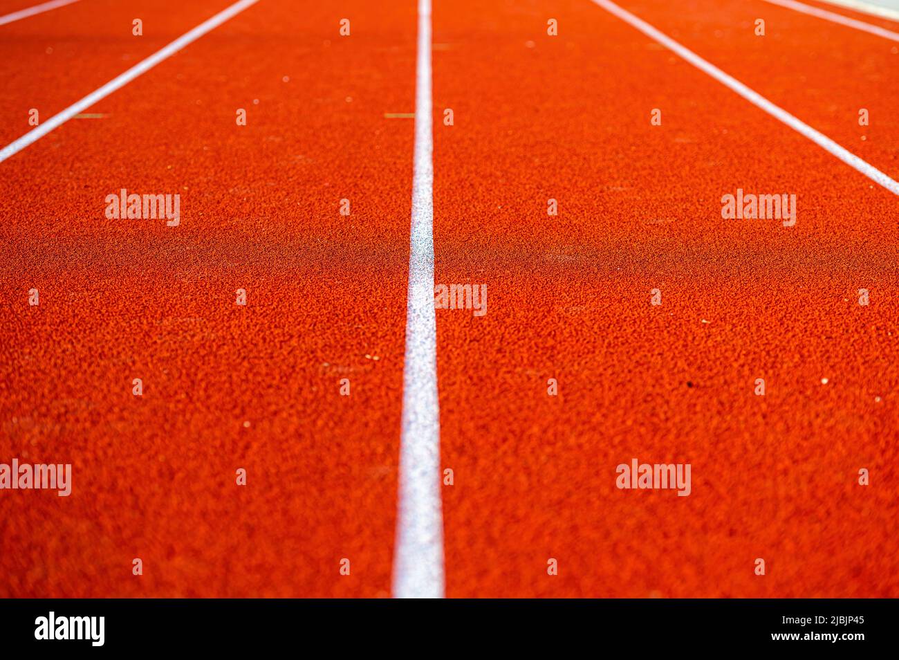 red runninng race track with border lanes, treadmill at stadium, sport ...