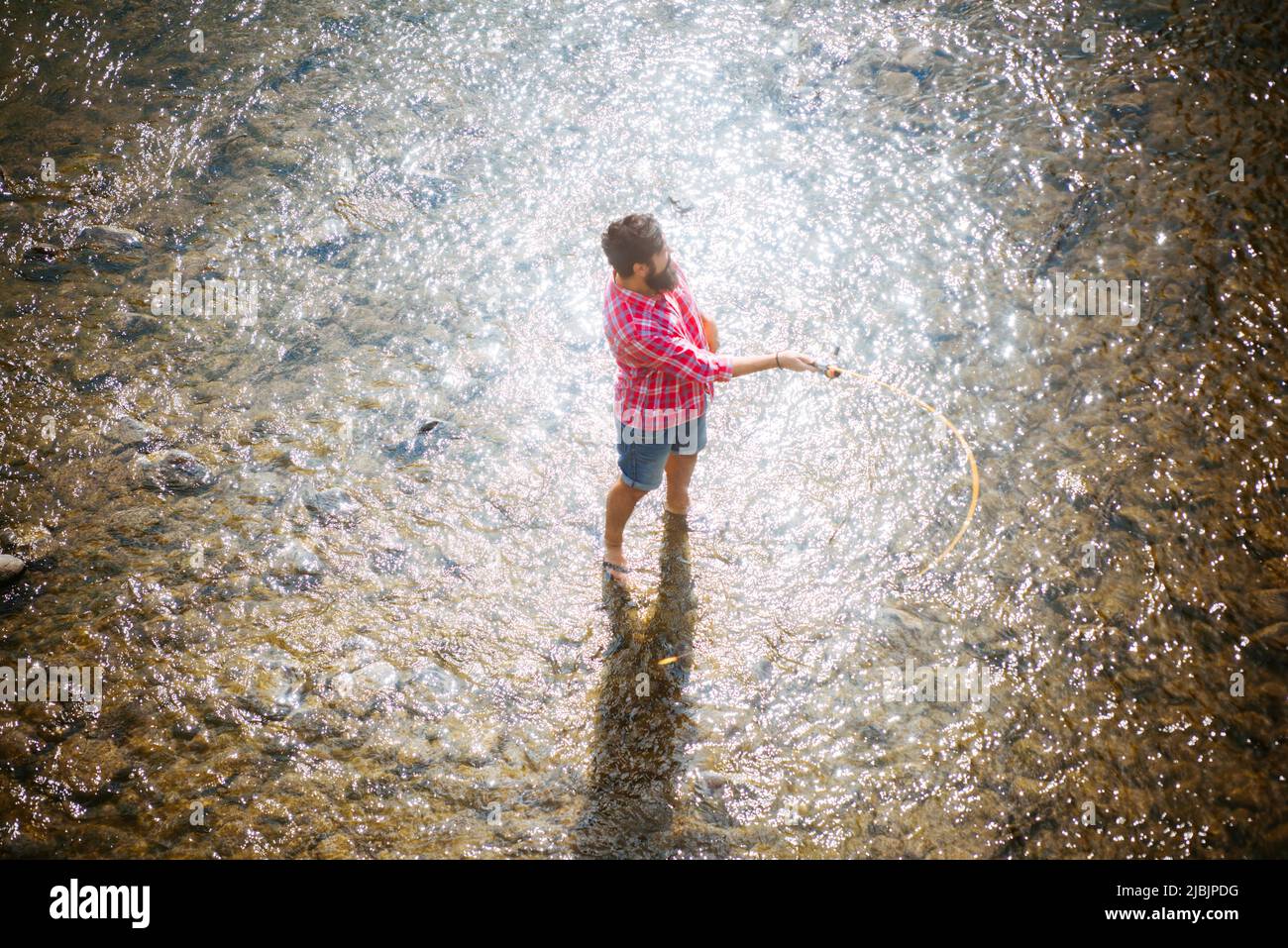 Man with fishing rod, fisherman men in river water outdoor. Summer ...