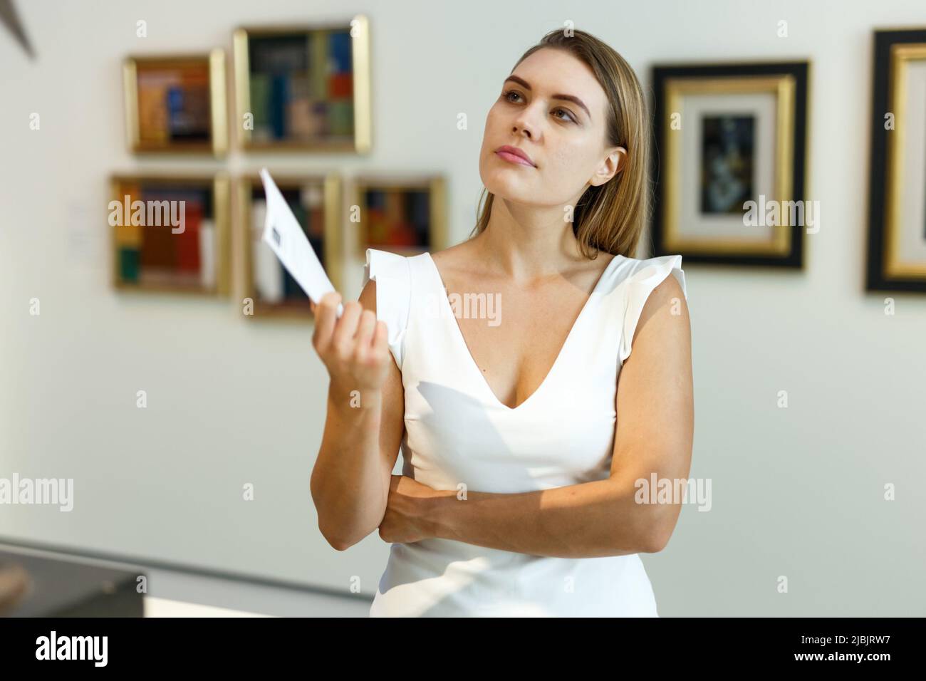 Woman visitor observing artwork hi-res stock photography and images - Alamy