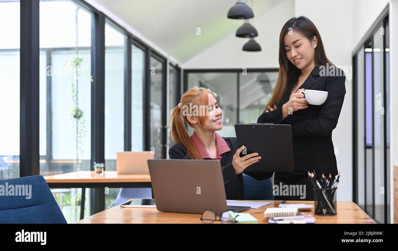 Friendly female manager giving some new ideas about project to new ...