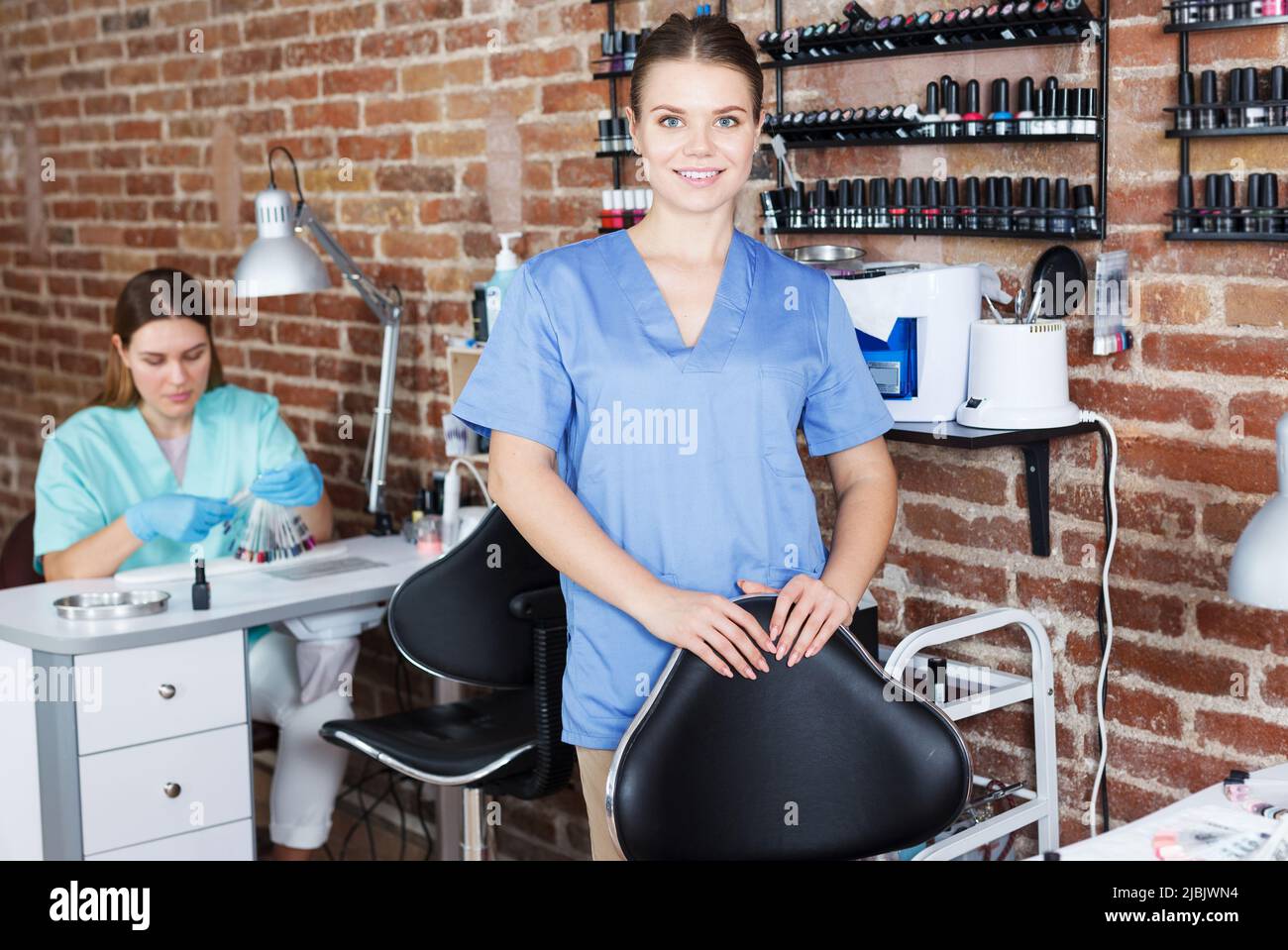 nail master standing at working place Stock Photo - Alamy