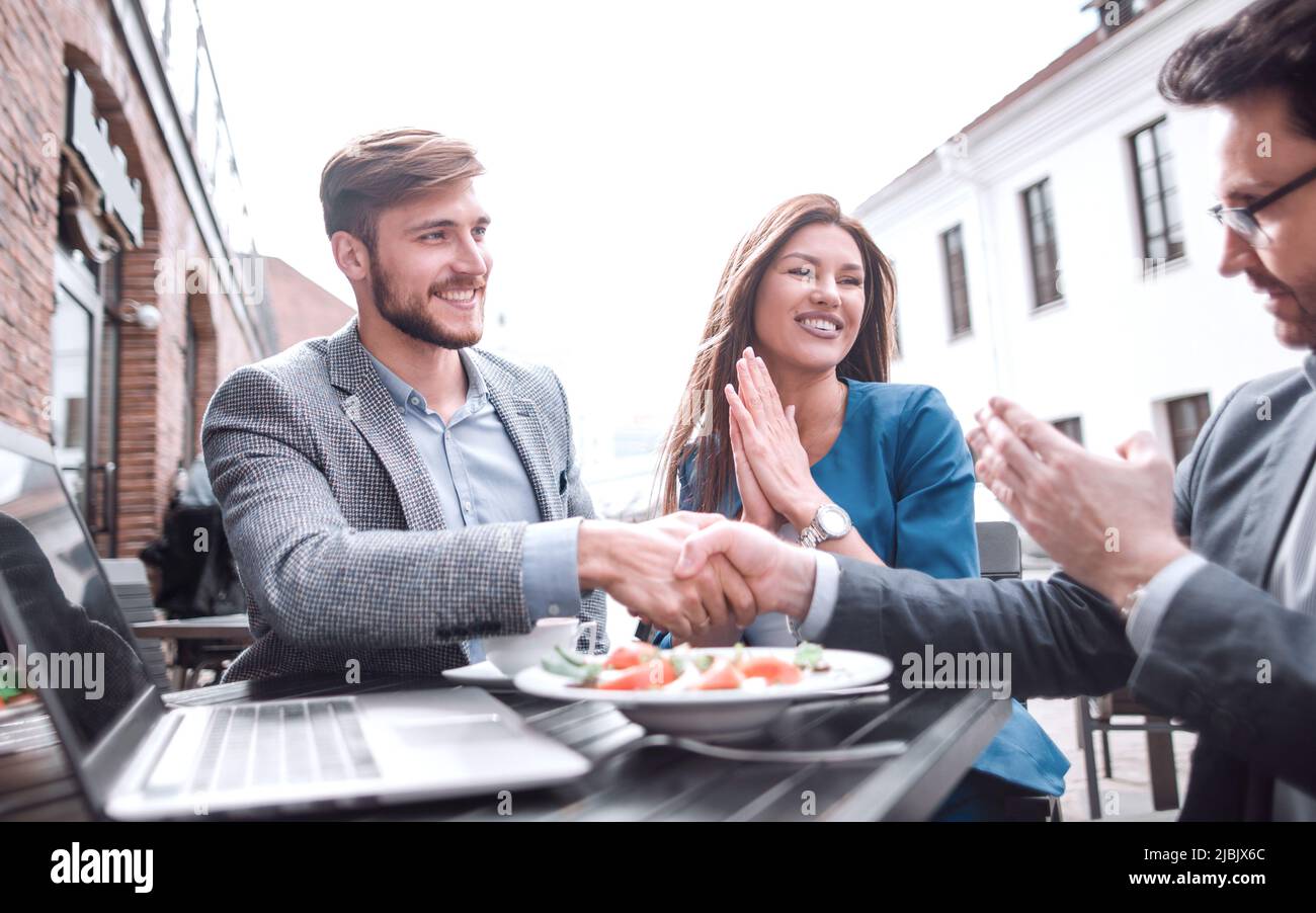 business partners greeting each other with a handshake Stock Photo - Alamy