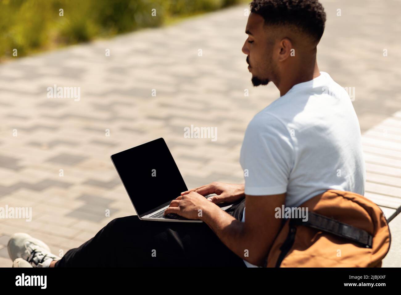 Technology concept. African american guy using modern pc computer with ...