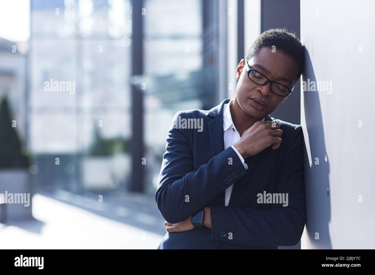 Close-up photo of an office worker, tired and overworked, has a severe ...