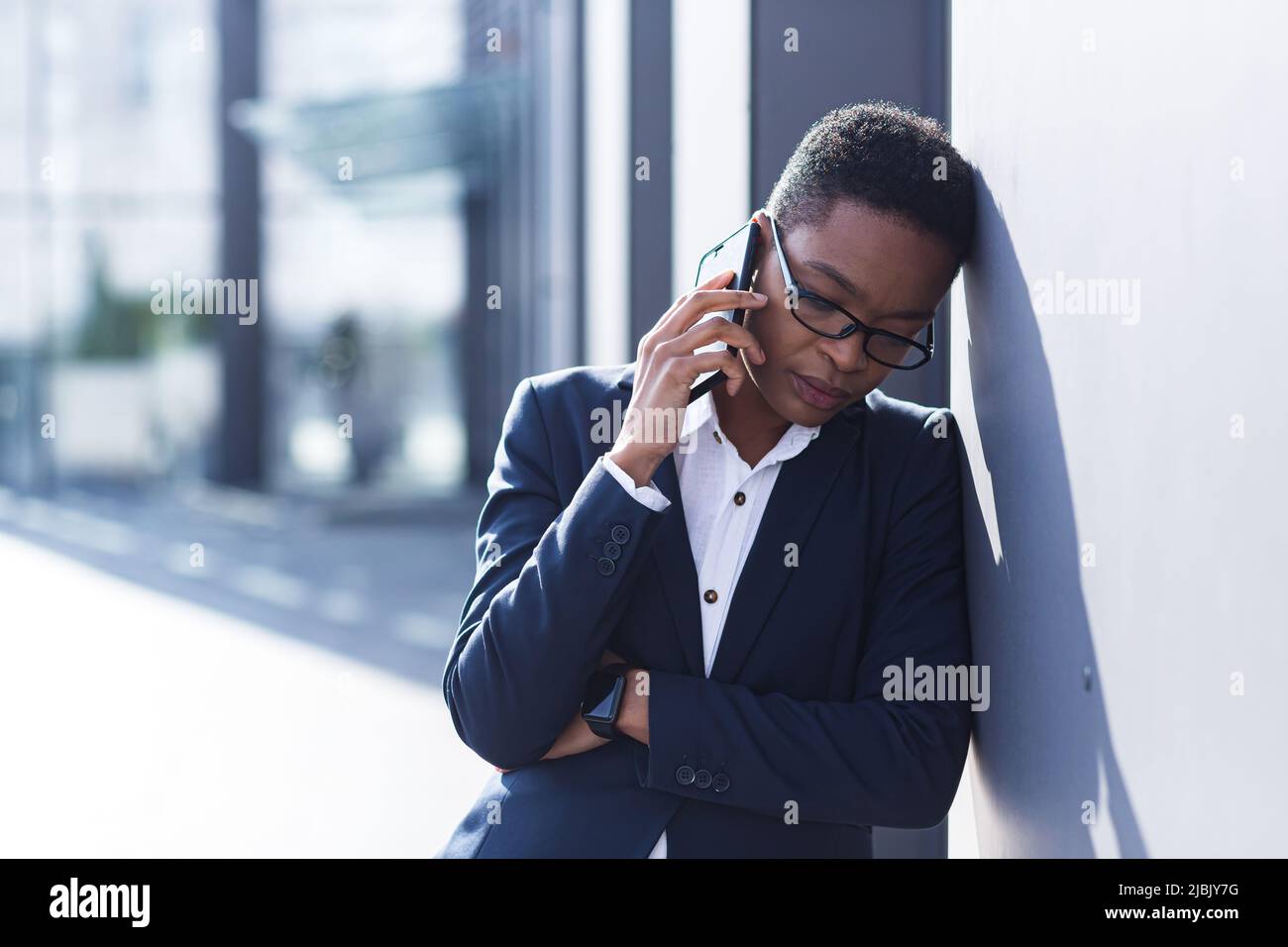 Woman businessman sad complains on the phone, reports bad news, African ...