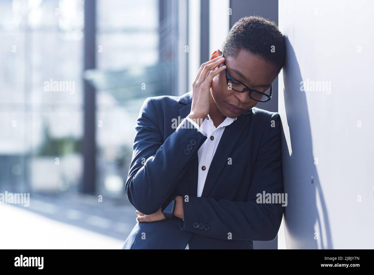 Close-up photo of an office worker, tired and overworked, has a severe ...
