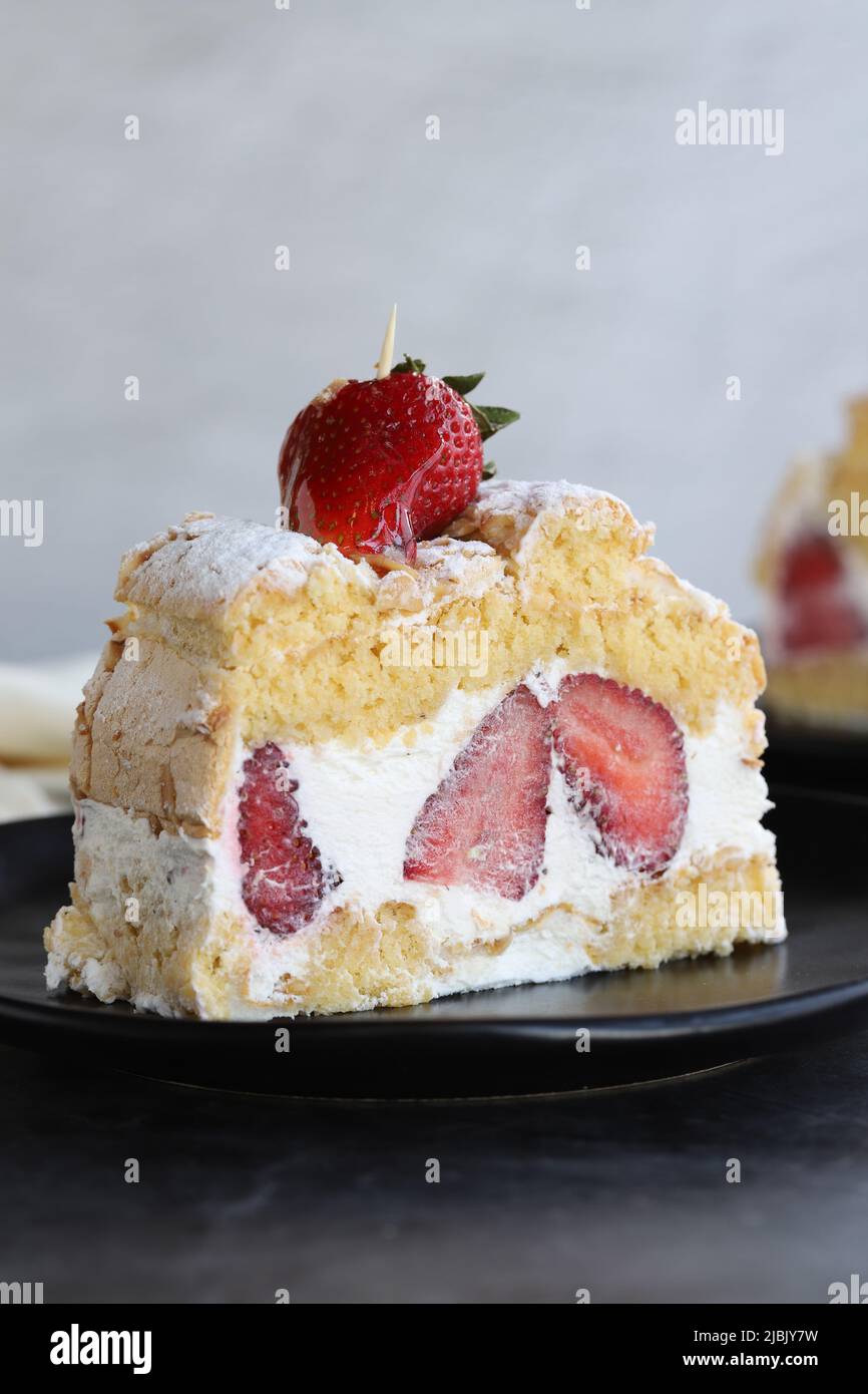 Strawberry log cake. close up Stock Photo - Alamy