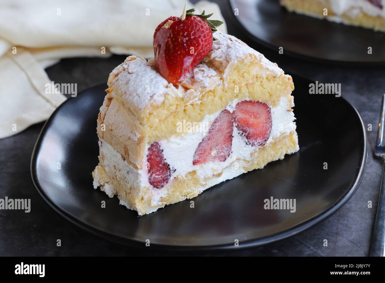 Strawberry log cake. close up Stock Photo - Alamy