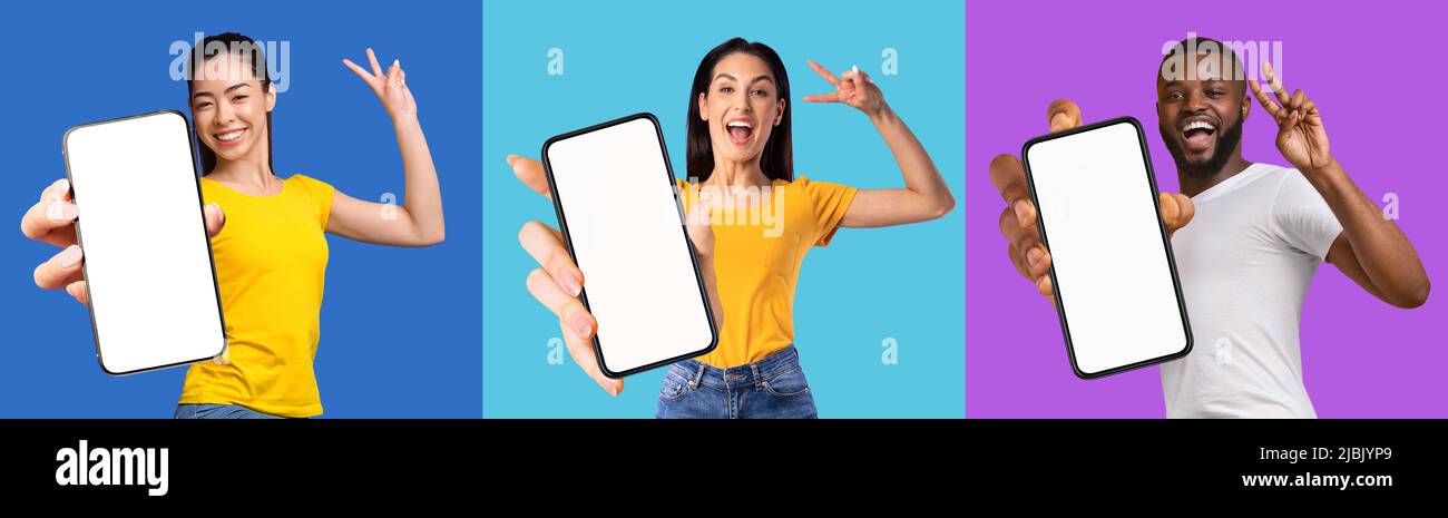Positive millennials showing smartphones with empty screens and peace ...