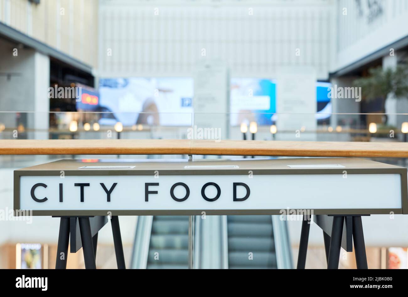 Background image of minimal City food logo in shopping mall interior ...