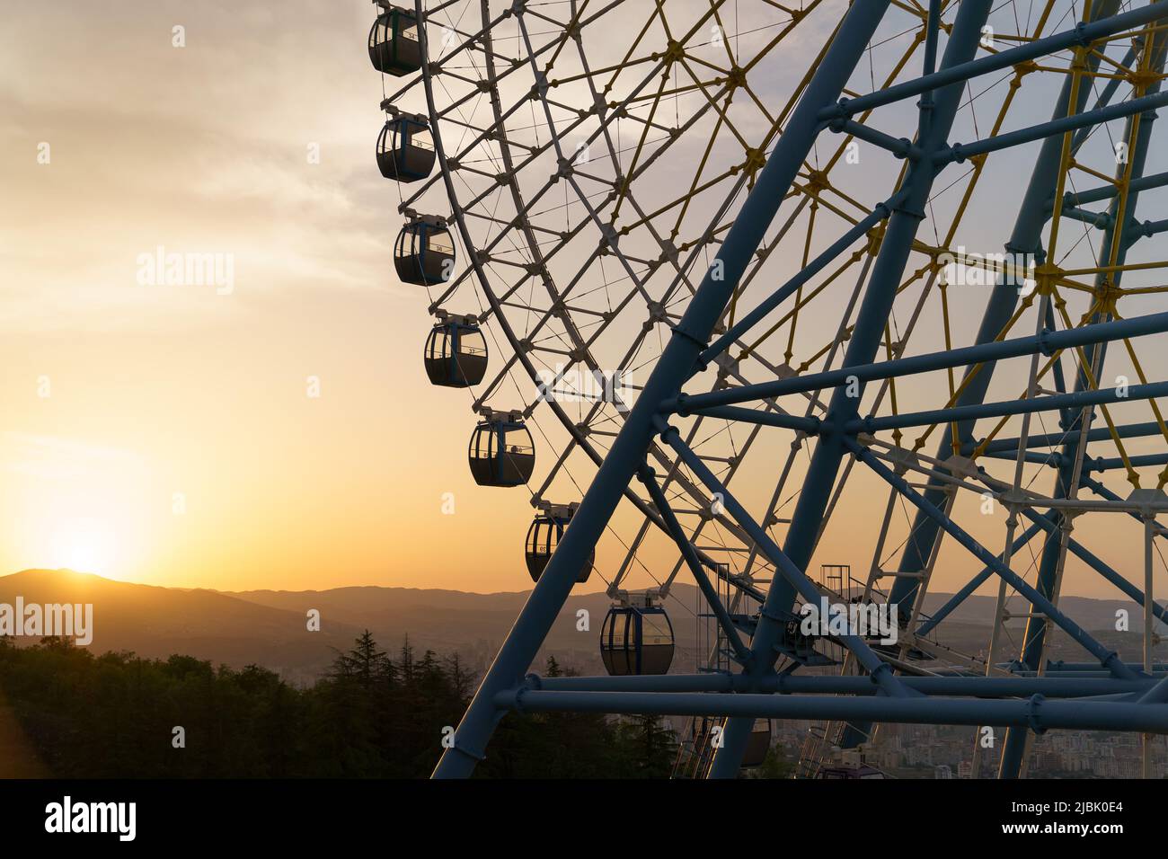 Ferris wheel in Mtatsminda amusement park in Tbilisi, Georgia. Giant ...
