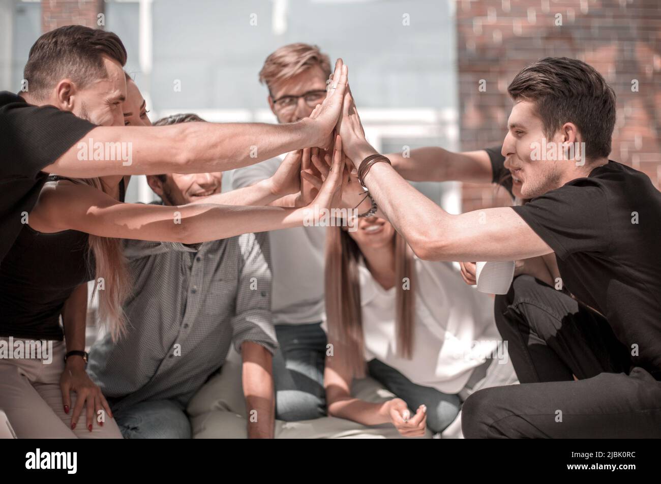 creative business team showing their unity Stock Photo - Alamy