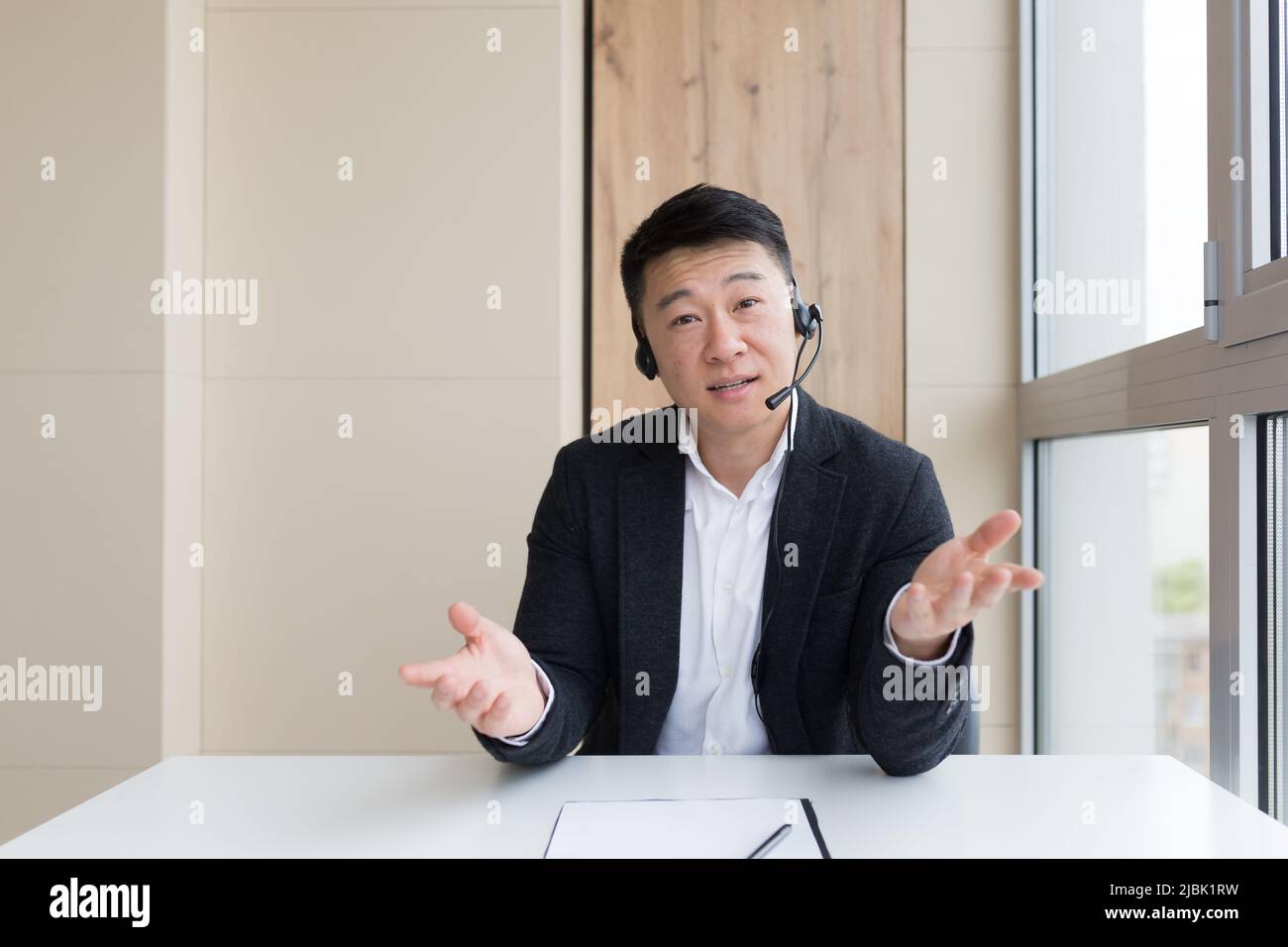 young asian male businessman talking online on video call, conference ...