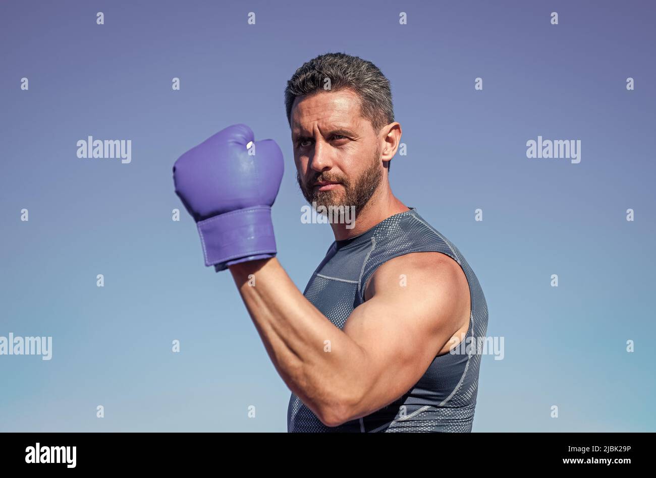 knockout. man boxer punching. fitness gym outdoor. muscular athletic ...