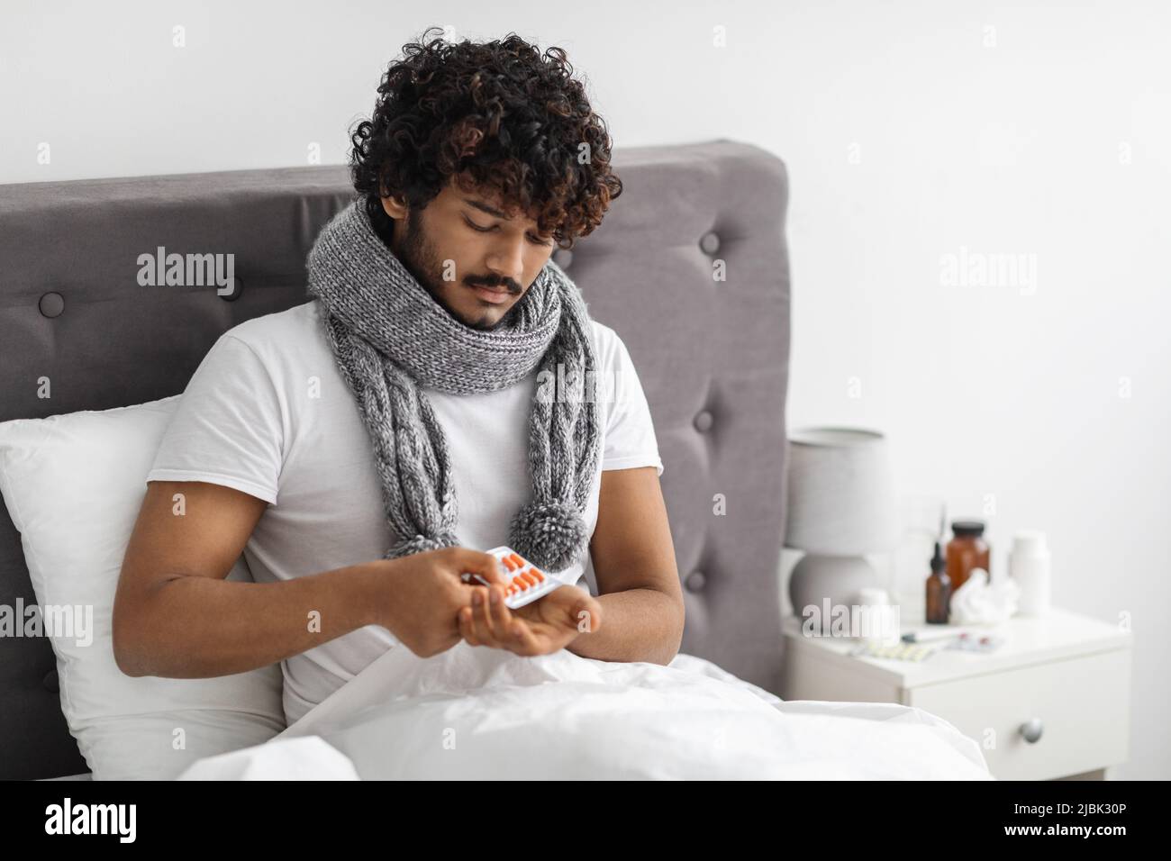 Indian man taking medicine hi-res stock photography and images - Alamy