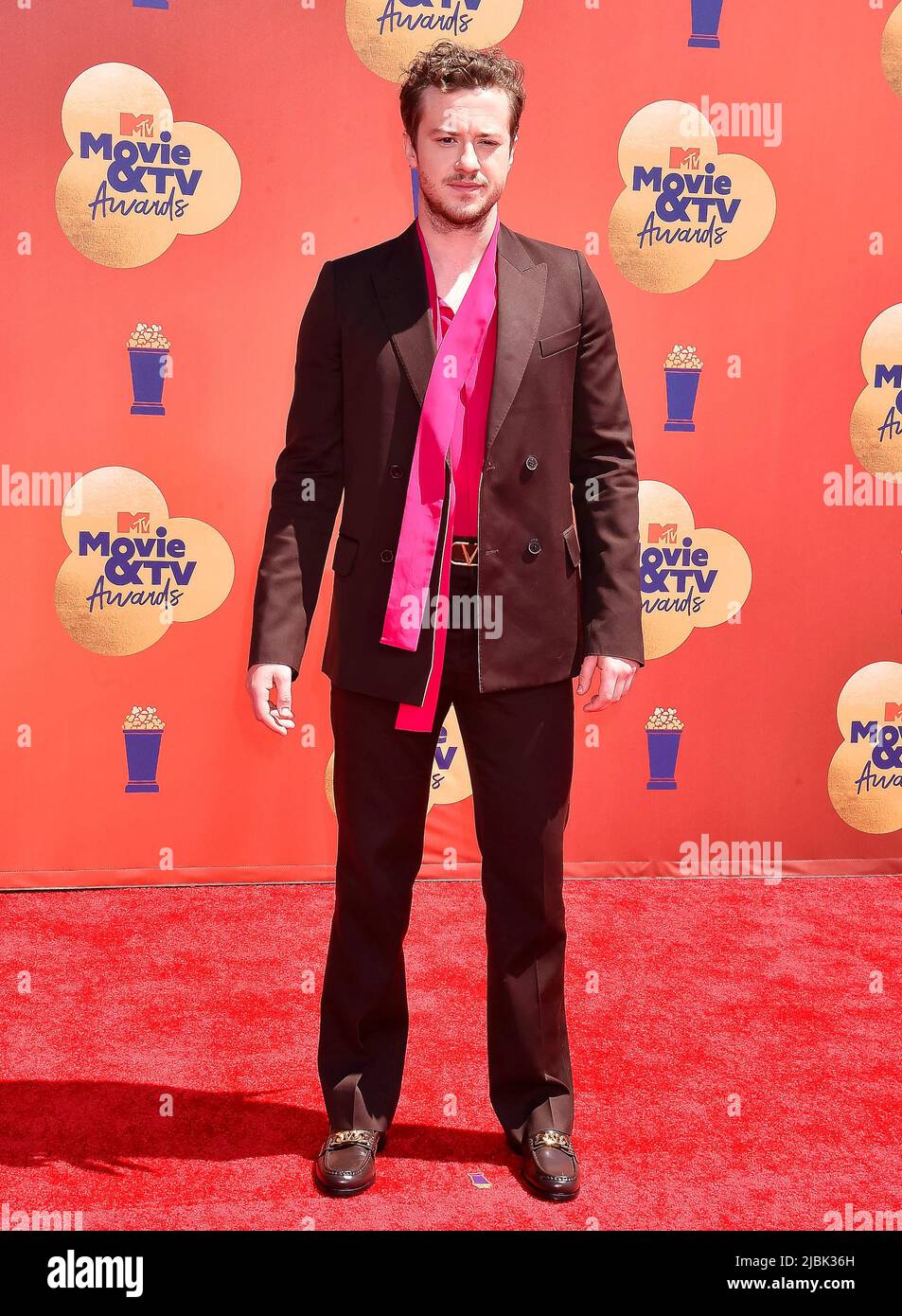 Joseph Quinn attends the 2022 MTV Movie and TV Awards at Barker Hangar ...