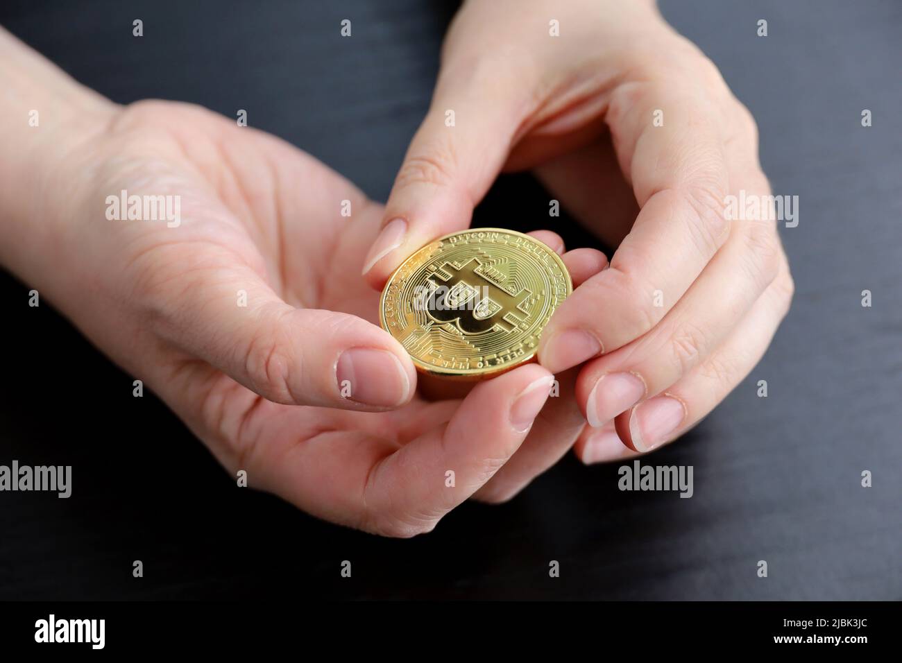 Bitcoin in female hands, electronic decentralized money, crypto ...