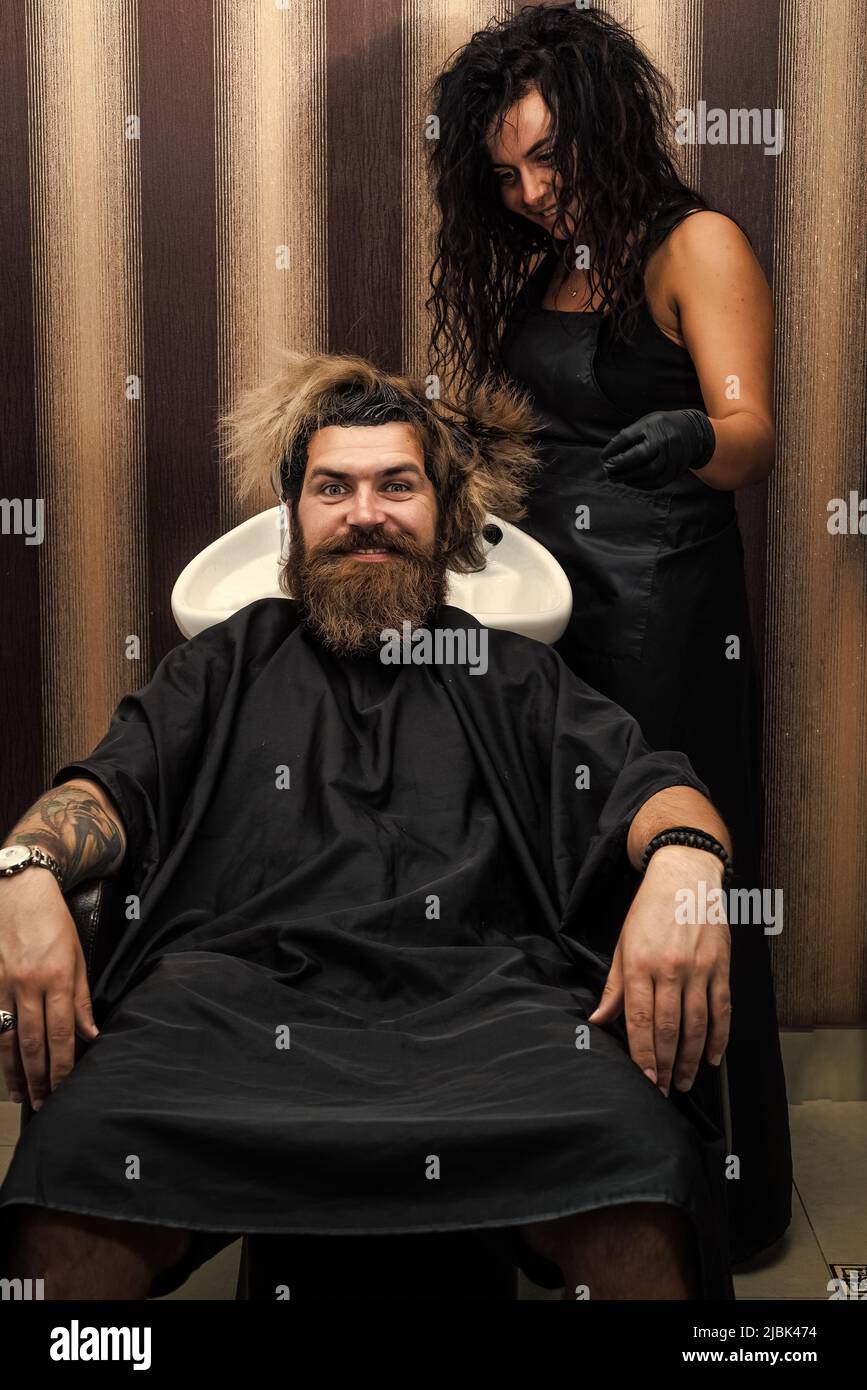 hair cut and beard care for caucasian guy in barbershop, refreshing ...