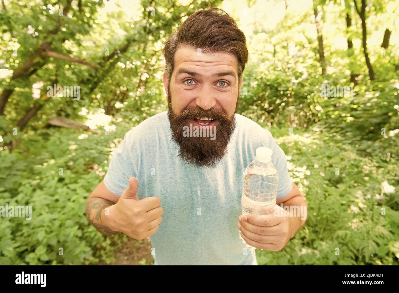 guy maintains body water balance. hydration. daily water. cheerful ...