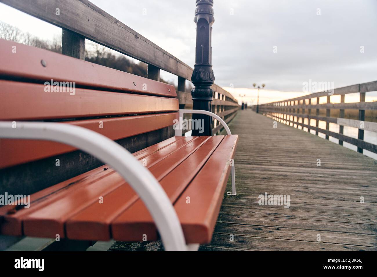 Bench on the boardwalk in the village of Yantarniy Stock Photo - Alamy