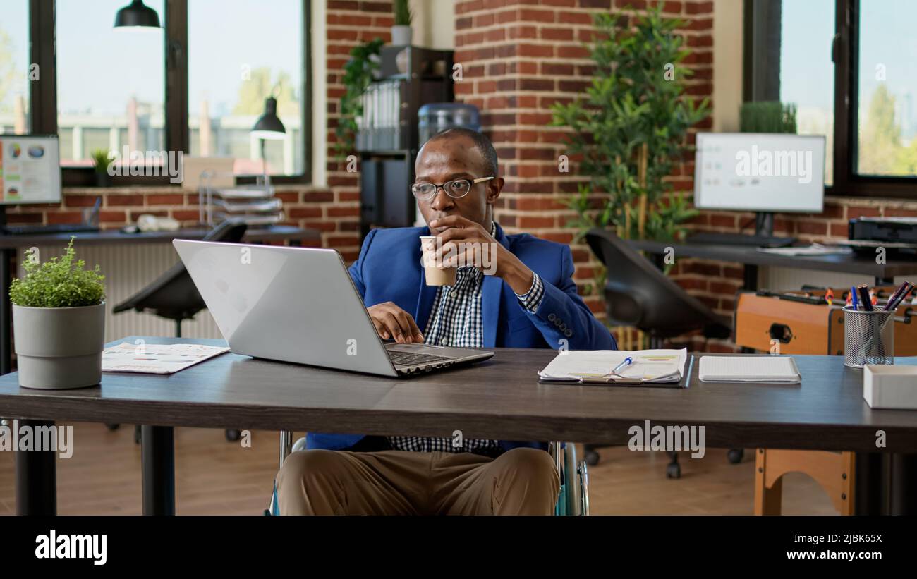 Entrepreneur with impairment working in disability friendly office ...