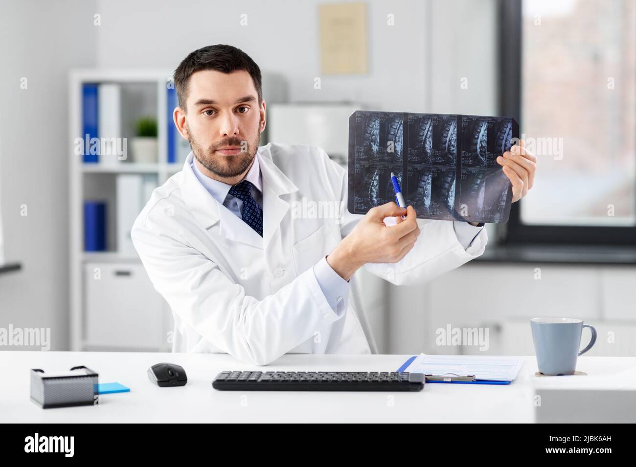 doctor with x-ray having video call at clinic Stock Photo - Alamy
