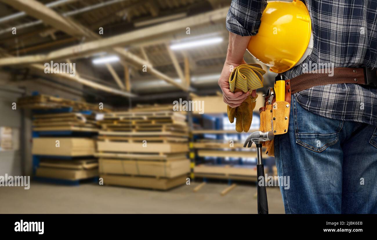 worker or builder with helmet and working tools Stock Photo - Alamy