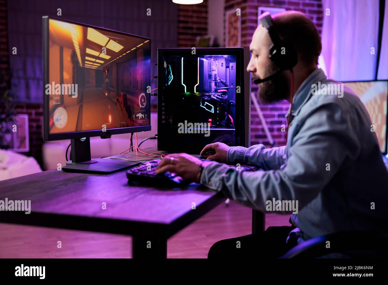 Internet live streamer playing online video games on computer, having ...