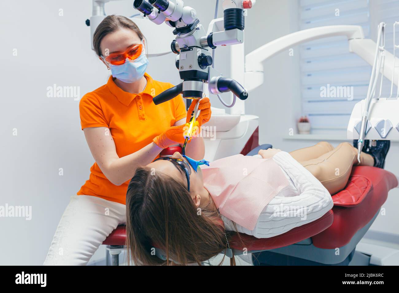Doctor treats teeth young hi-res stock photography and images - Alamy