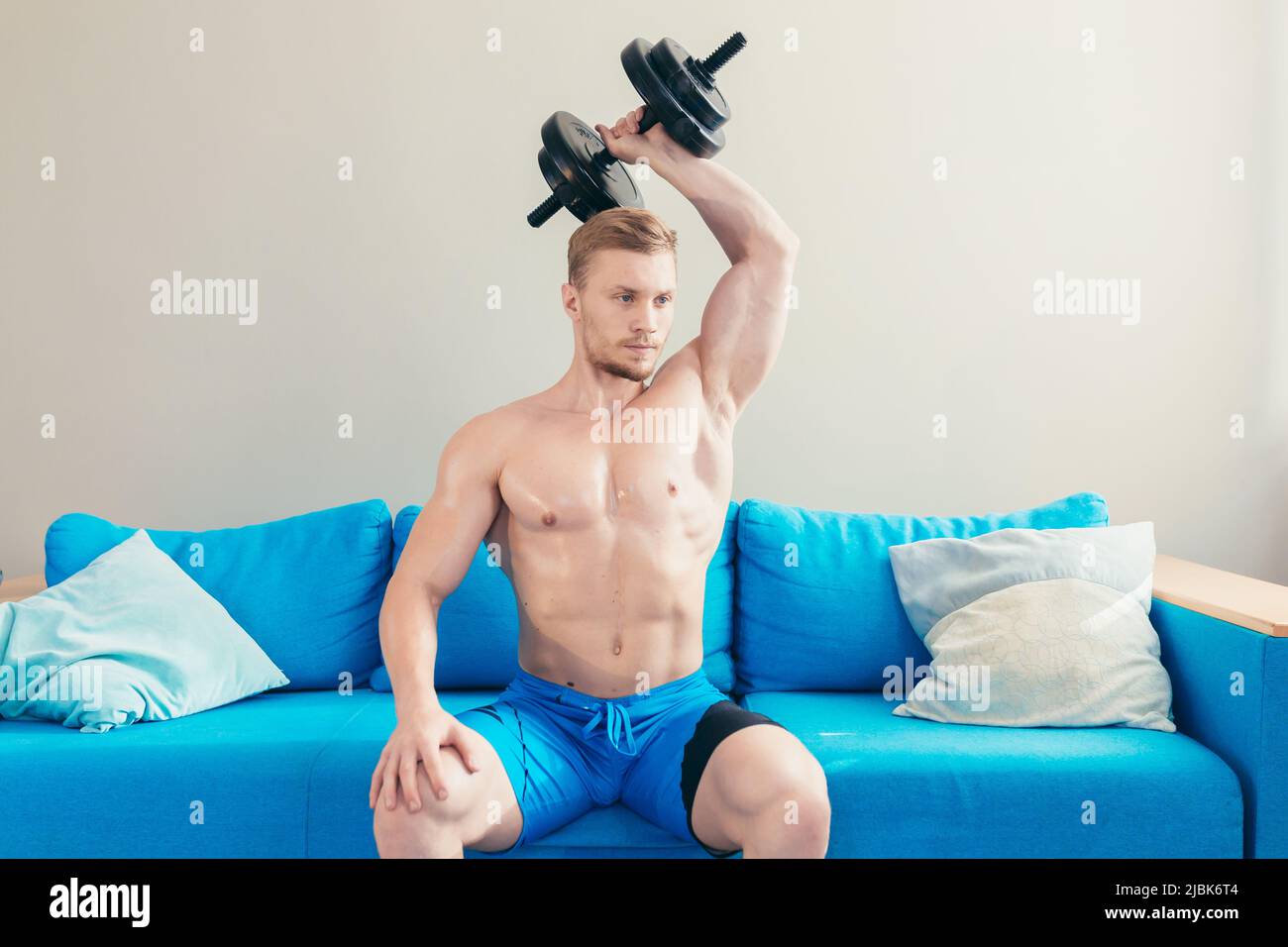 Bodybuilder sitting on sofa hi-res stock photography and images - Alamy