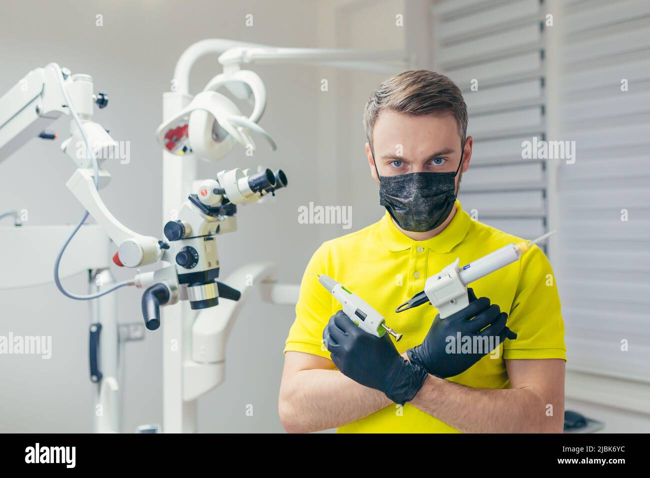 Dentist in yellow gloves black hi-res stock photography and images - Alamy