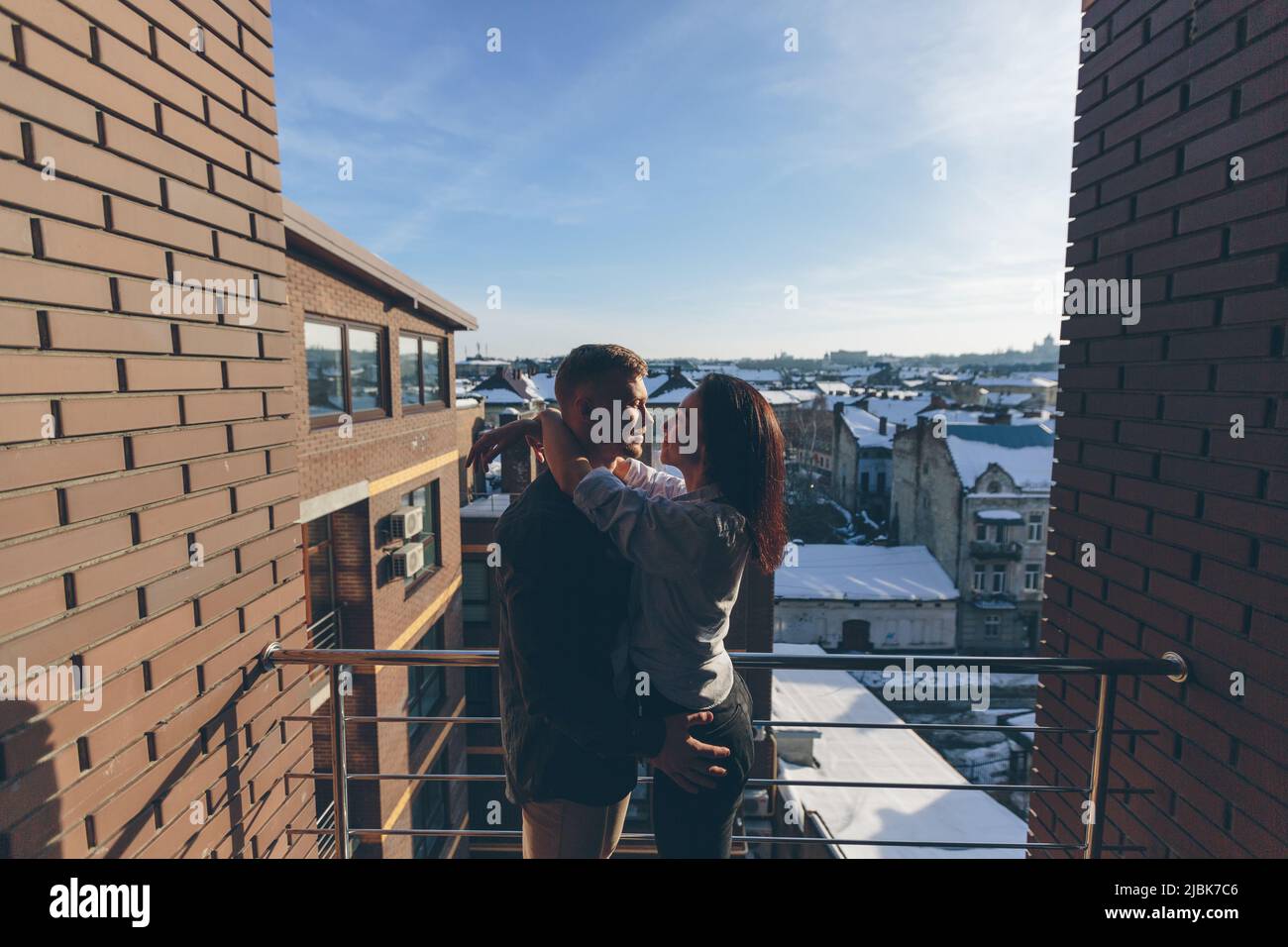 Couple kissing on balcony in hi-res stock photography and images - Alamy