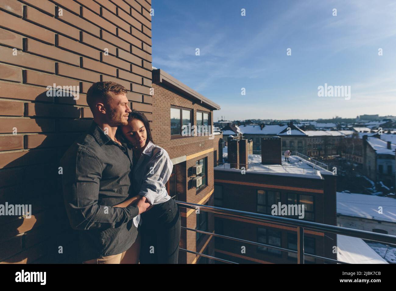 Couple kissing on balcony in hi-res stock photography and images - Alamy