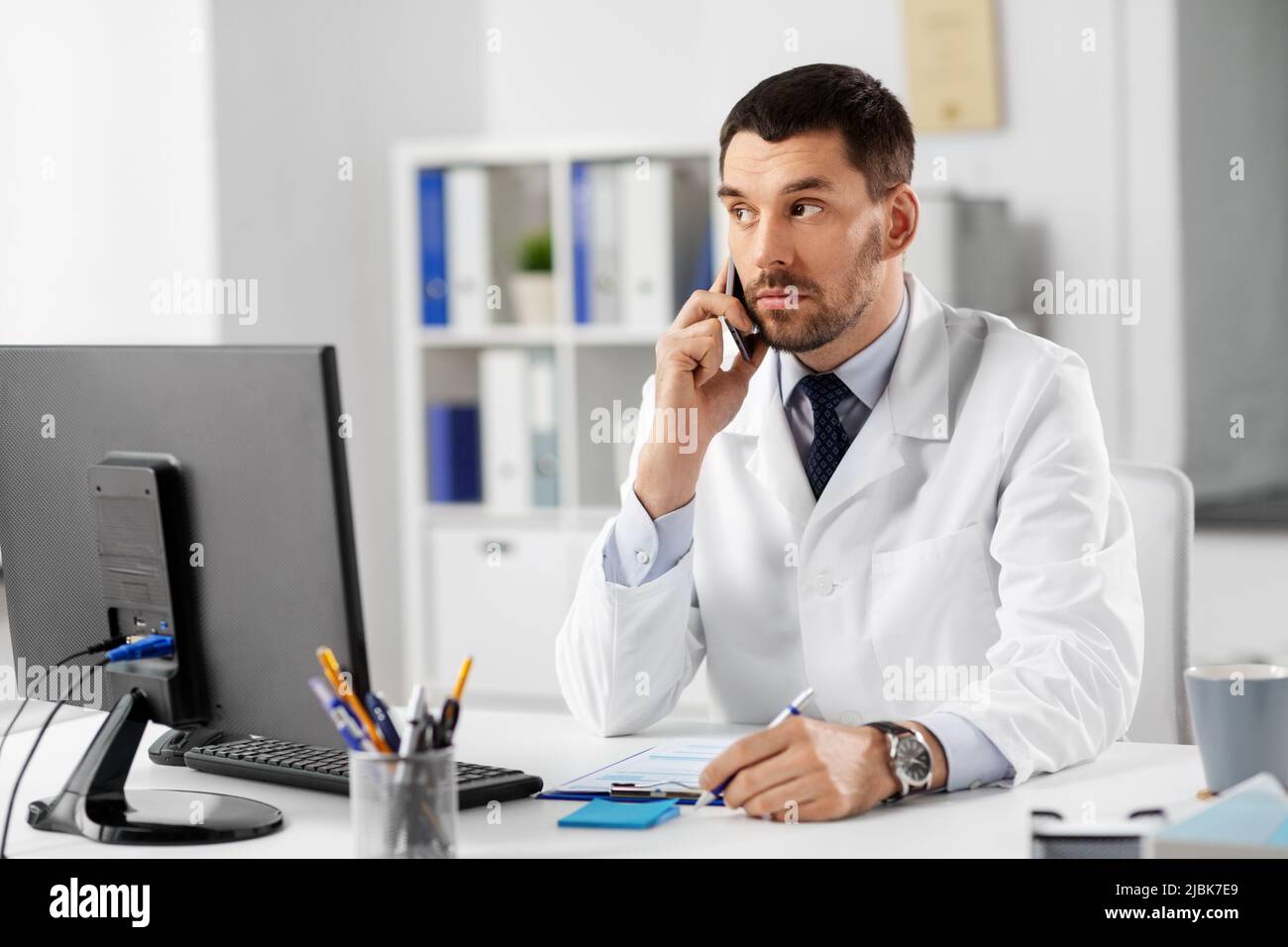 Hispanic doctor phone hi-res stock photography and images - Alamy