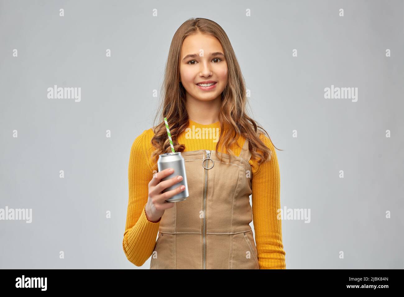 happy teenage girl drinking soda from can Stock Photo - Alamy