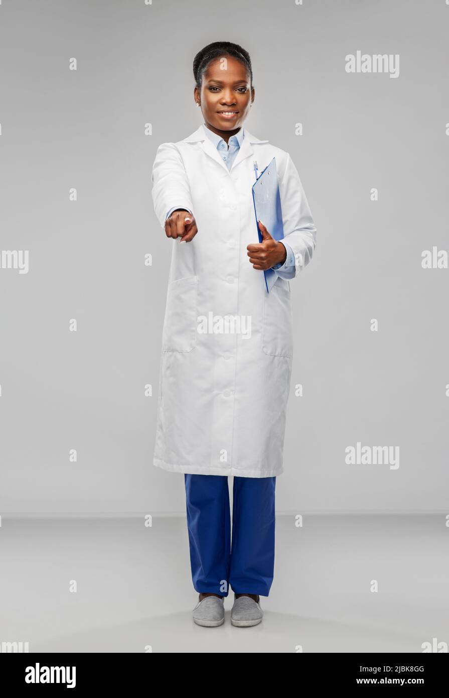 african female doctor pointing finger to camera Stock Photo - Alamy