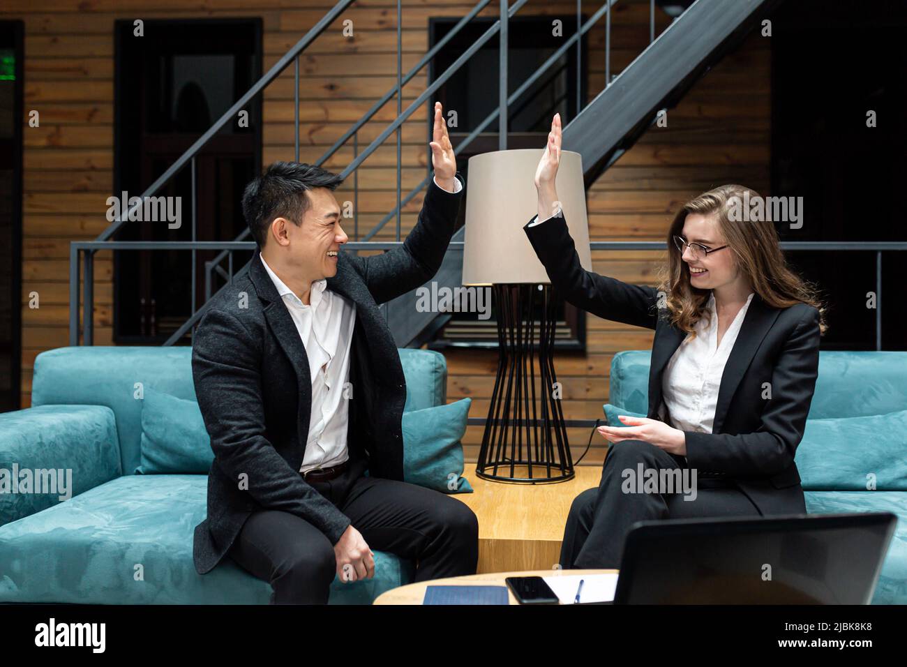Man and woman smiling colleagues celebrate business victory, achieving ...