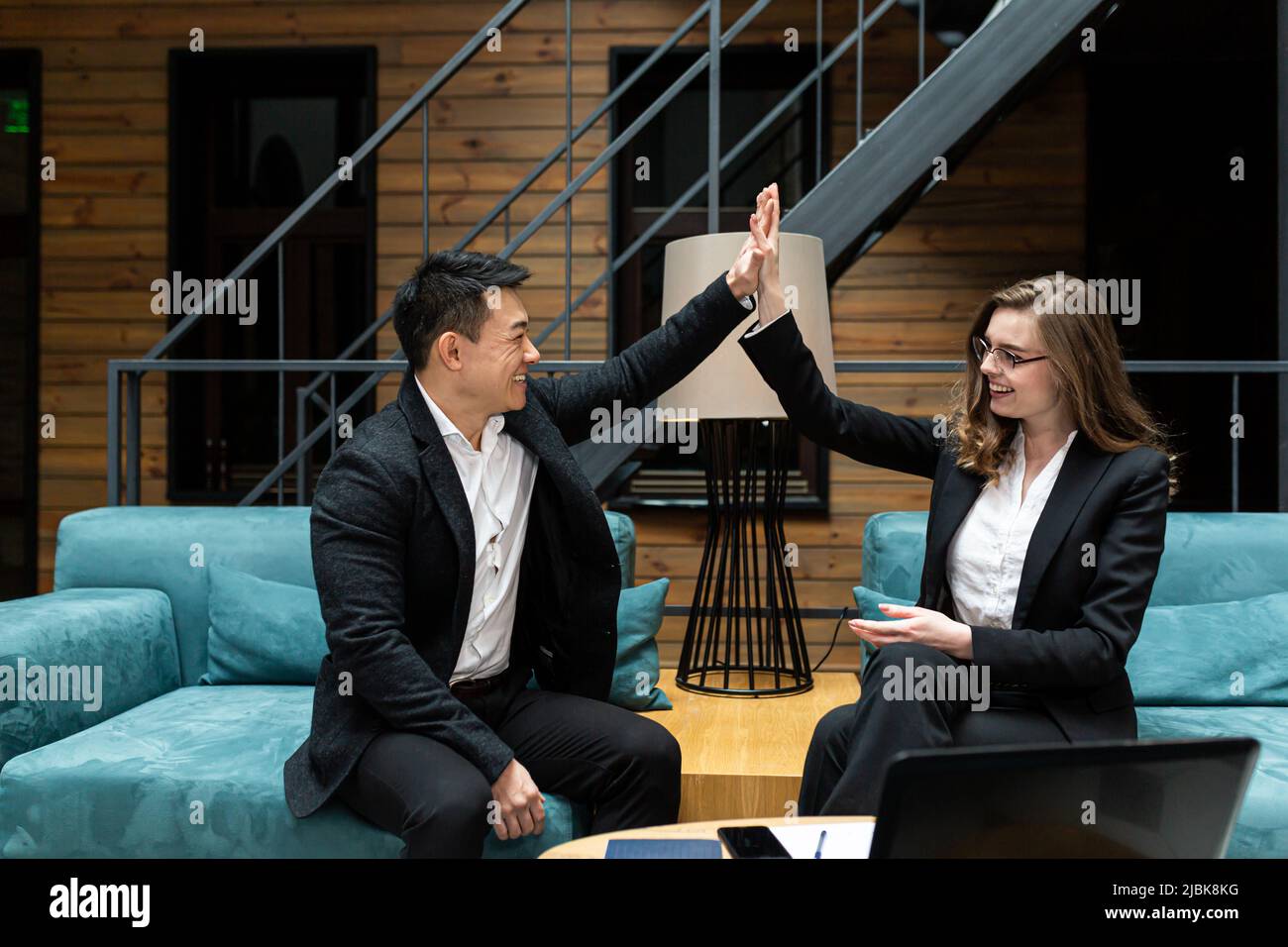 Man and woman smiling colleagues celebrate business victory, achieving ...