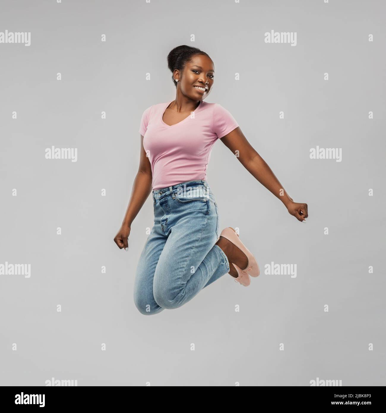 Beautiful young woman jumping over hi-res stock photography and images ...