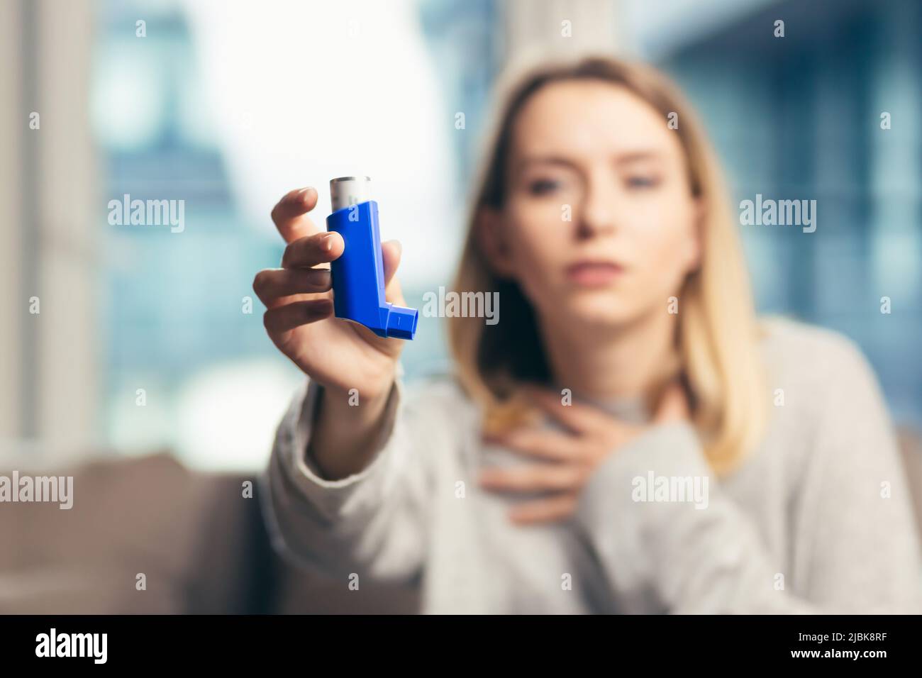 Beautiful girl while holding inhaler Stock Photo - Alamy