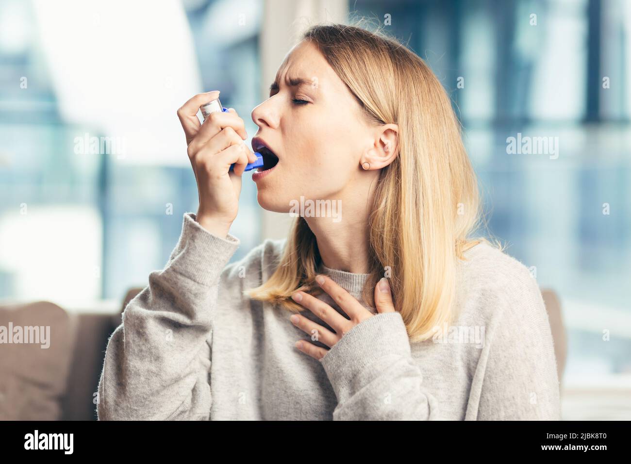 Asthma inhaler female adult blue hi-res stock photography and images ...